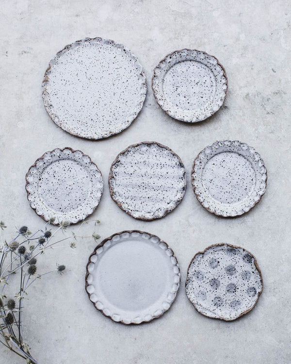 Gritty rustic cake plates with patterns and decorative scalloped rims ...