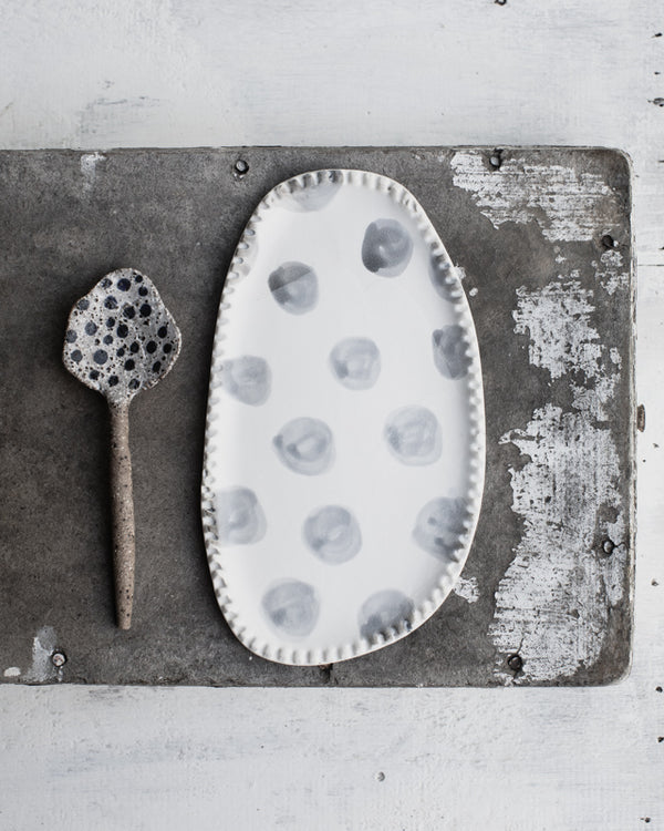 Oval spotty plate and little gritty spotty spoon. - Clay Beehive